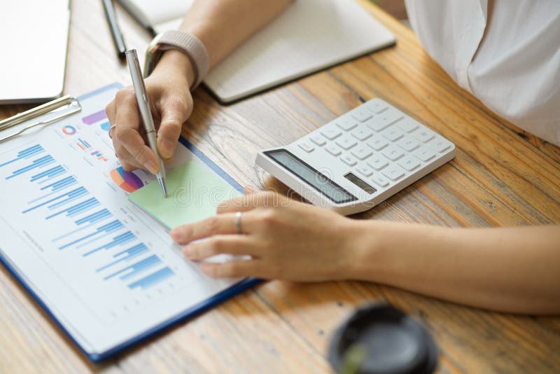 An Accountant or Business Owner Writes on Sticky Notes Stock Photo ...