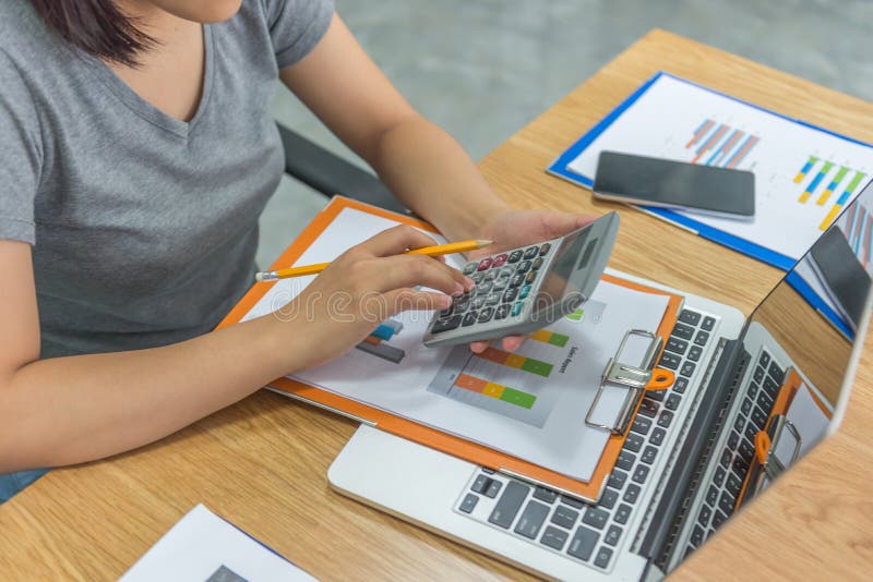 Accountant Hand Using Calculator To Check Financial Reports Stock Photo ...