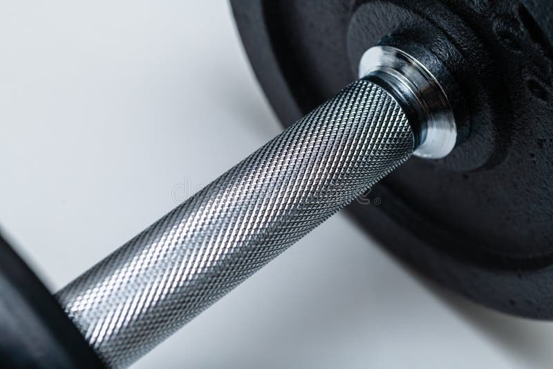 Close-up of Adjustable Dumbbell Handle with Attached Weights on White ...