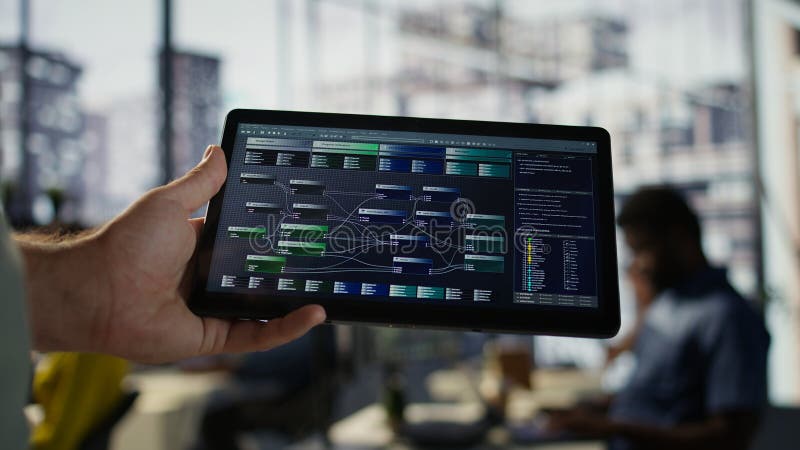 Close Up Of Admin In Office Sing Tablet To Design Machine Learning Algorithms Stock Image