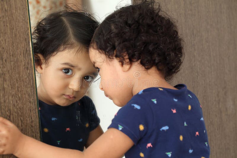 Close Up of Adorable Baby Boy Looking at His Reflection Stock Image ...