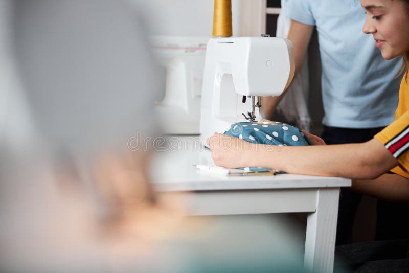 Joyful Cute Girl Sewing Fabric in Workshop Stock Photo - Image of ...