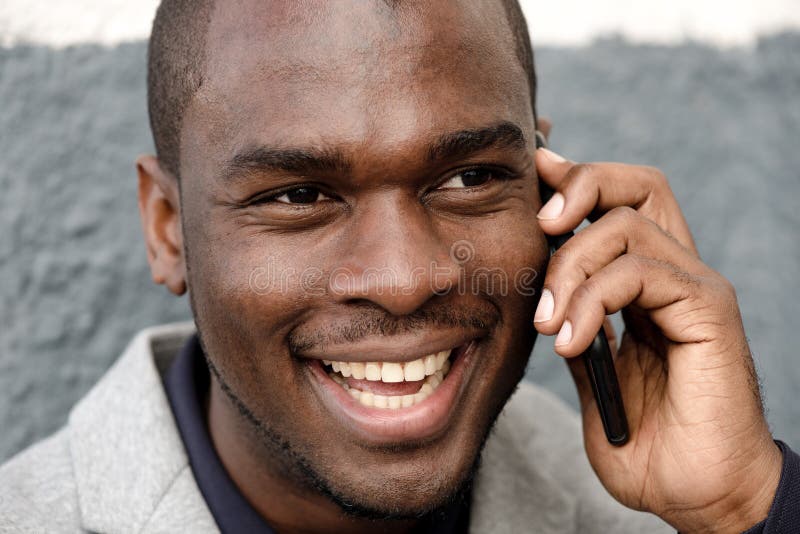Close Up African American Man Smiling and Talking with Phone Stock ... Close Up African American Man Smiling and Talking with Phone Stock ...