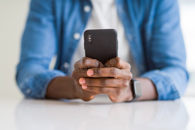 Close Up of African Man Hands Using Smarpthone Stock Photo - Image of ...