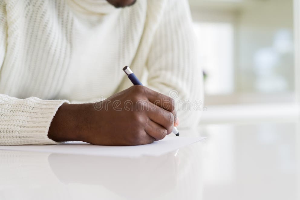 Close Up of African Man Writing a Note on a Paper Stock Image - Image ...