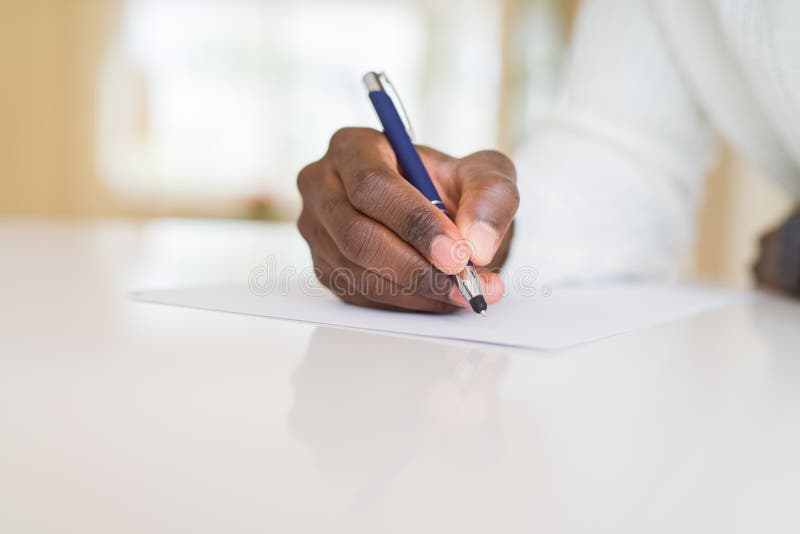 Close Up of African Man Writing a Note on a Paper Stock Photo - Image ...