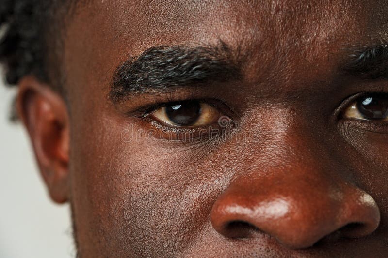 Close Up of African Mans Face with Brown Eyes Studio Shot Stock Image ...