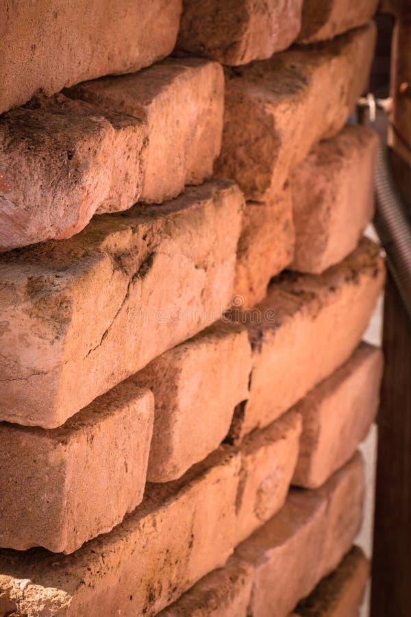 Wall of bricks piled up stock image. Image of brick - 217469193