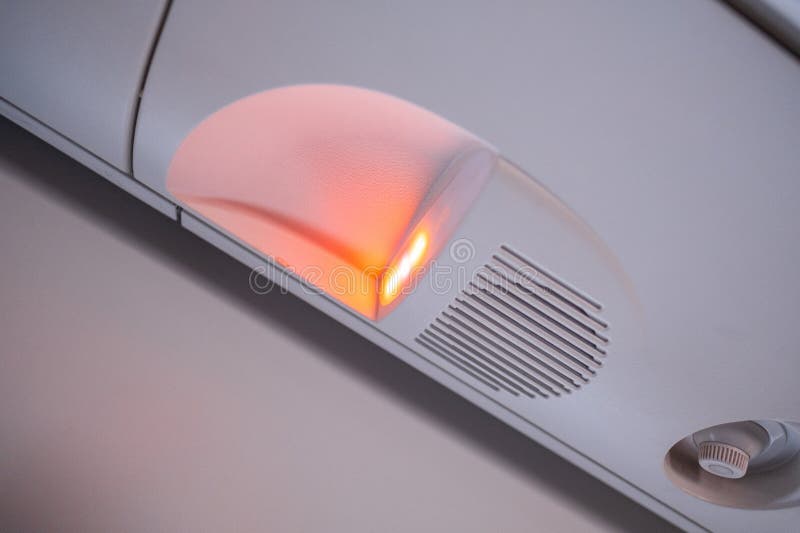 Close-Up of Airplane Cabin Ceiling with Illuminated Reading Light ...