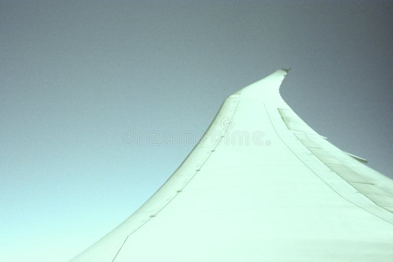Airplane Wing in mid sky stock image. Image of life - 125683265