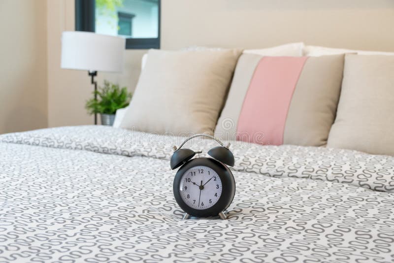 Close Up of Alarm Clock on Bed Stock Photo - Image of bedside, alarm ...