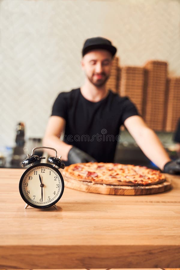 Close Up Alarm Clock with Pizza and Backer Stock Photo - Image of boxes ...