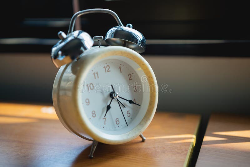Close Up of Alarm Clock on Wood Office Table Stock Image - Image of ...