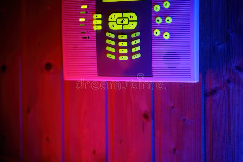 Alarm System Control Keypad with Glowing Green Led at Dark Night with ...