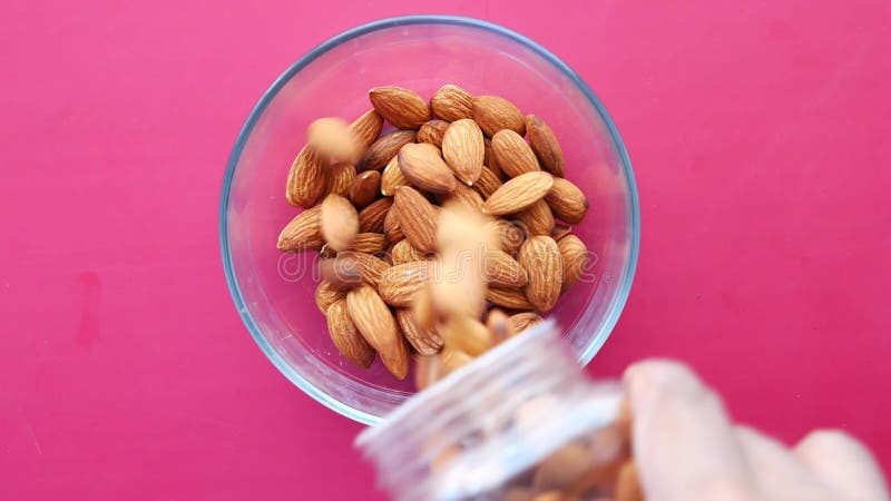 Top View of Pouring Almond Nuts in a Bowl Stock Video - Video of bowl ...