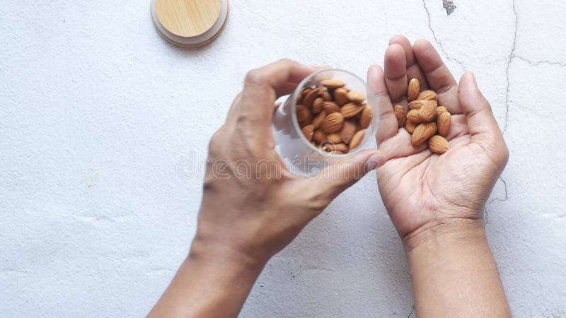 Top View of Pouring Almond Nut from a Jar on Table Stock Footage ...