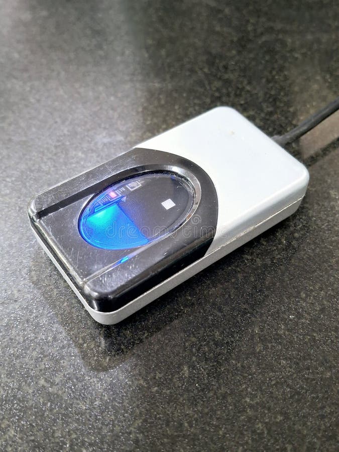 A Close-up, Angled View of a Fingerprint Reader, Placed on a Dark ...