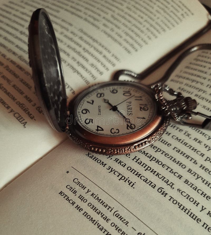 Close Up of Antique Bronze Pocket Watch and Opened Book Stock Photo ...