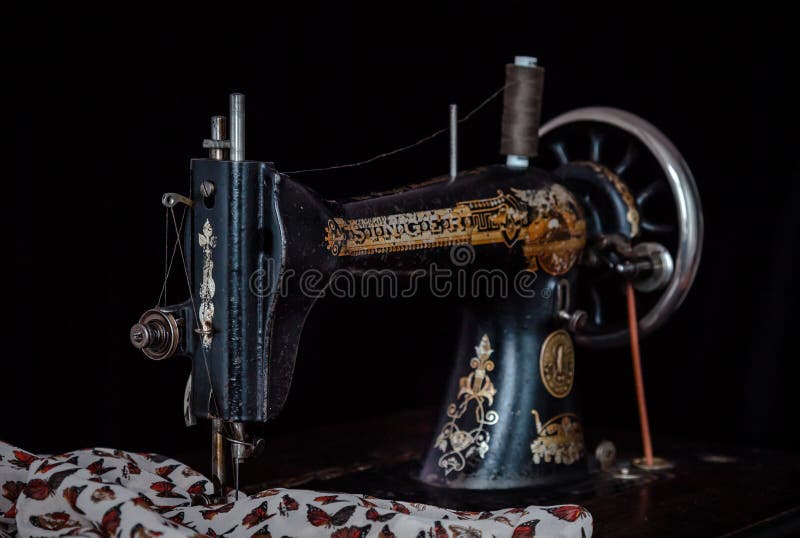 Close Up of Antique Sewing Machine Singer on Black Background ...