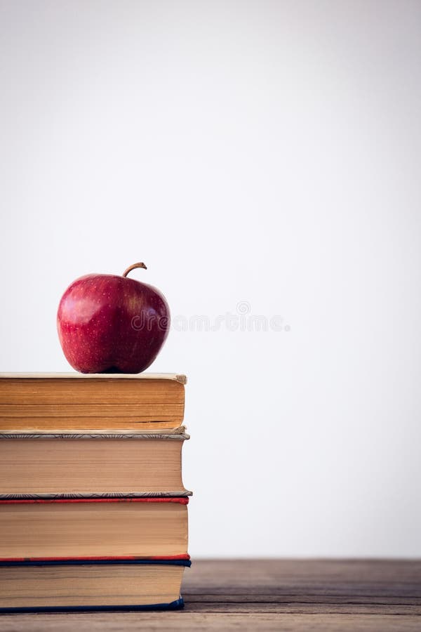 Close Up Of Apple On Books At Table Stock Image - Image of food ...