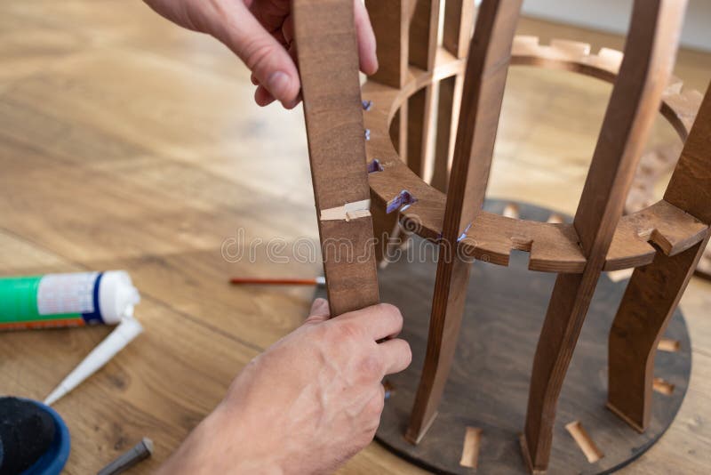 Applying Glue on the Wood. Carpenter at Work Using Glue in His Workshop ...