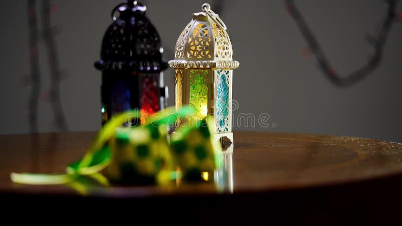 Arabic Lantern and Ketupat on Round Table with Bokeh Light Stock ...
