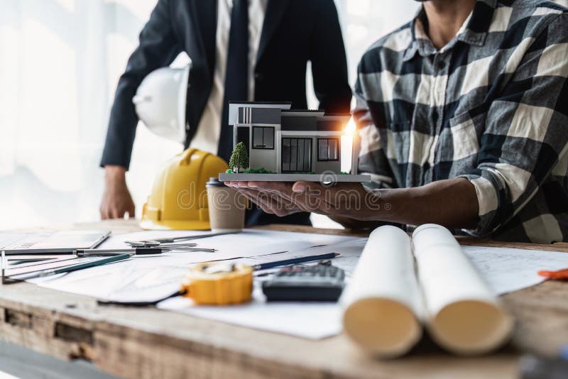 Close Up of Architect Team Working with House Model for Architectural ...