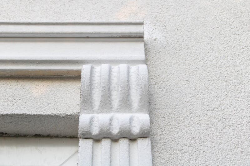 Close-up of Architectural Decorative Element on Textured White Wall ...