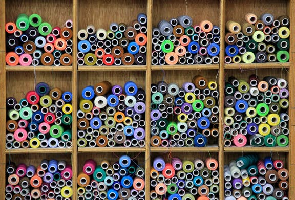 Close Up of an Array of Colorful Spools of Thread in Different Sizes ...
