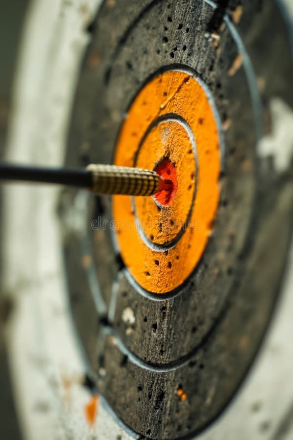 A Close Up of an Arrow Hitting the Center of an Archery Target ...