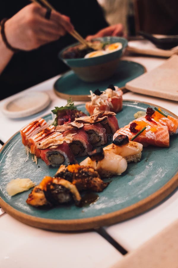 Close-up of Artful Sushi Platters Set on a Dining Table. Stock Photo ...