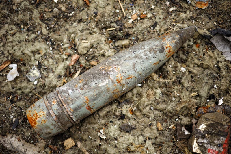 Artillery Shell on the Ground Stock Photo - Image of ammo, copper ...