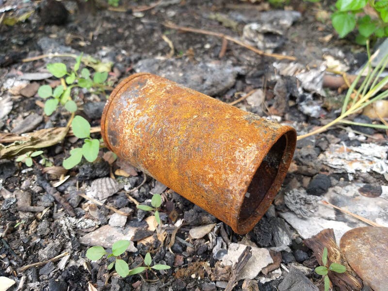 Ash and can on the ground stock image. Image of garbage - 162266883