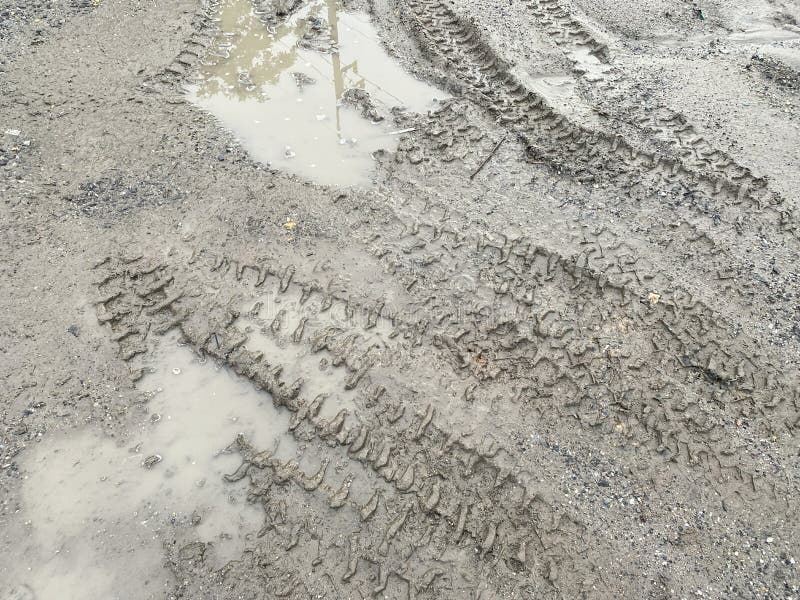 Asphalt Road with Dirt Tracks on the Ground Stock Photo - Image of ...