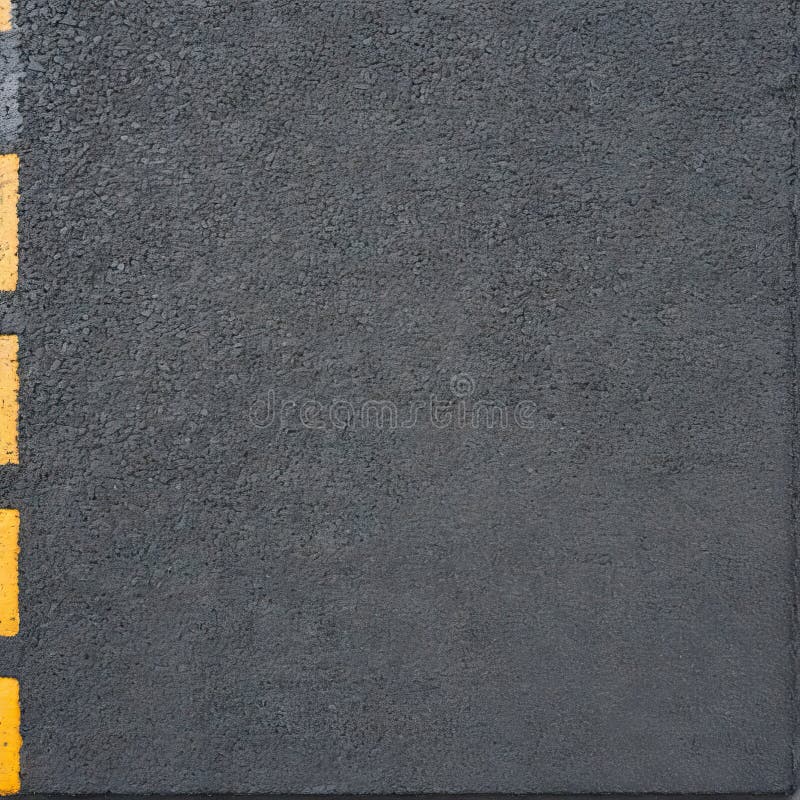 Close-up of Asphalt Road Texture with Yellow Stripes Marking the Edge ...