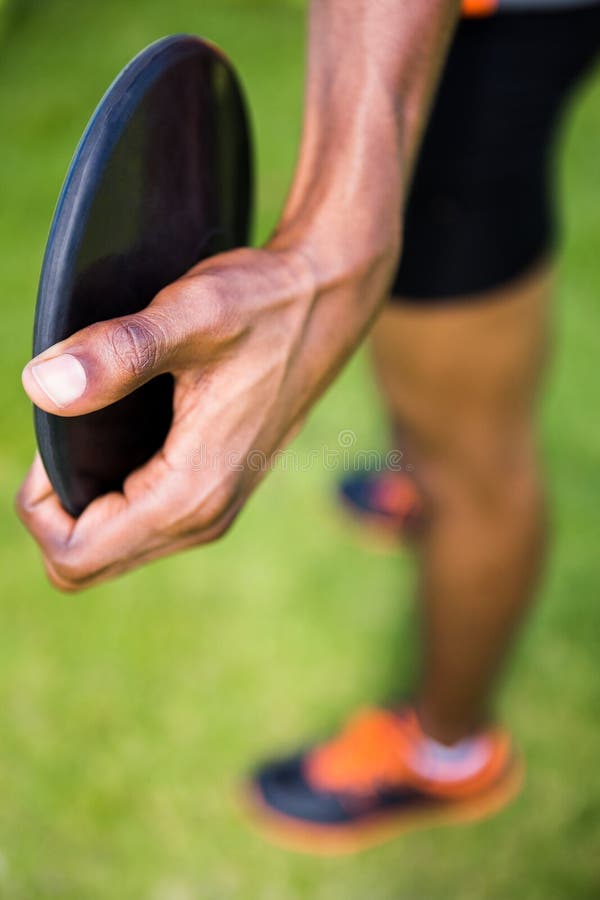 Close-up of Athlete Holding a Discus Stock Image - Image of black ...