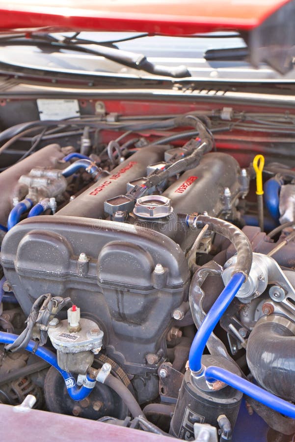 Close-up of an Automobile Engine Compartment, with Blue Hoses and ...