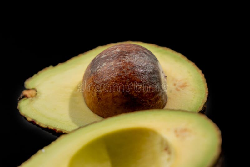 A Close Up of an Avocado with the Pit Still Inside Stock Image - Image ...
