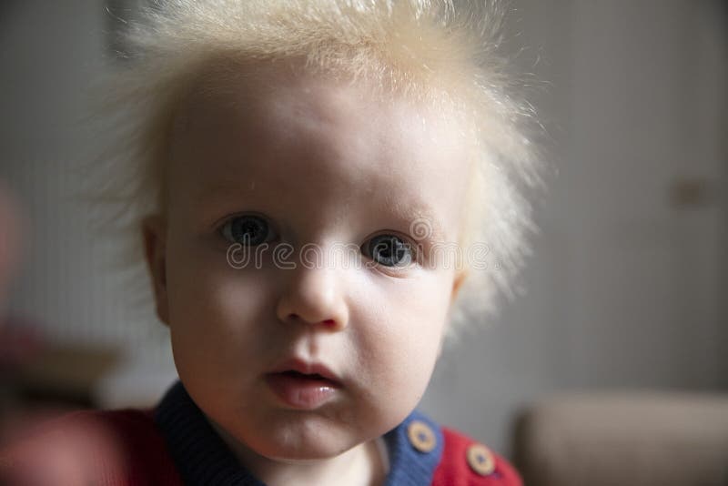 Close Up of a Baby Boy Looking Directly at the Camera with Big Blue ...