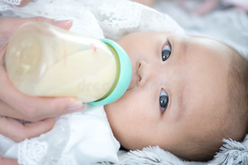 Baby Sucking Milk from Bottle Stock Image - Image of dream, relax ...