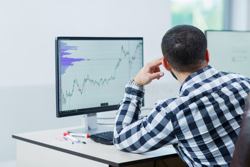 Man Using Project Management Software on Laptop Computer Stock Photo ...