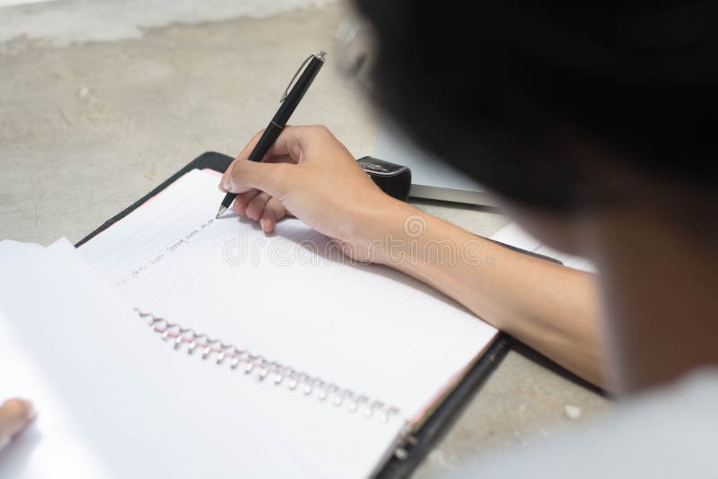 A Close Up Back View Man Doing Home Work and Studying and Doing ...