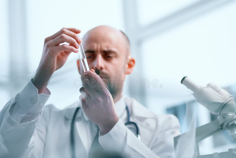 Background Image of a Researcher Examining Samples of a New Vaccine ...