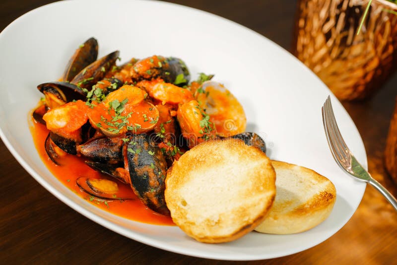 Baked Shellfish Mussels with Potatoes and Bread Stock Photo - Image of ...