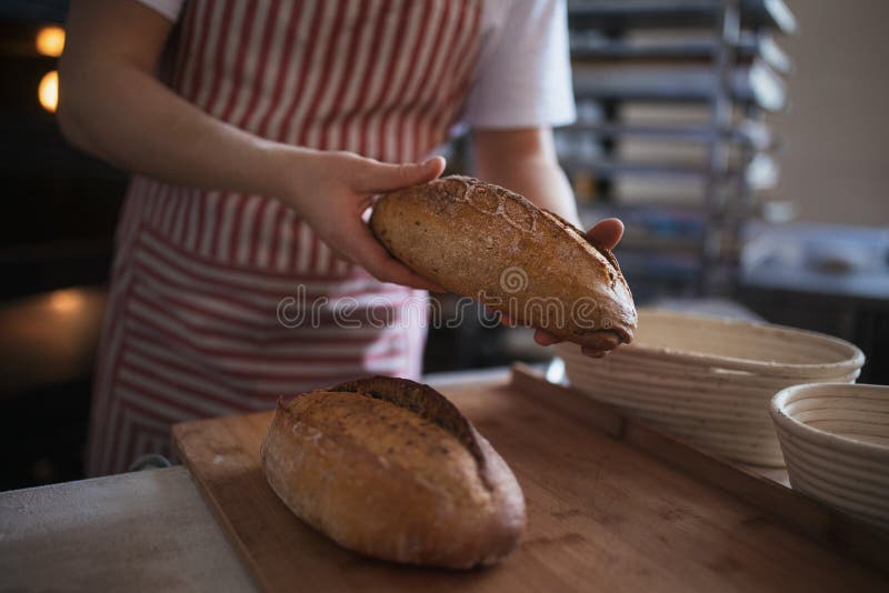 Close-up of Baker with Fresh Bread in Bakery. Stock Photo - Image of ...