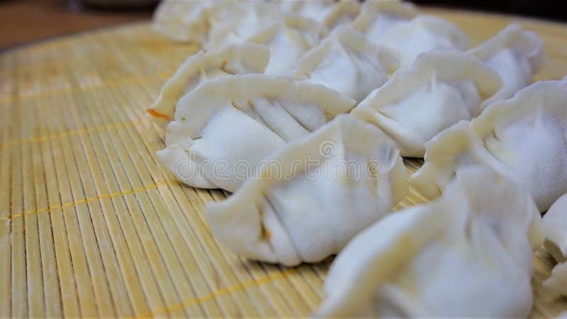 Close-up of a Bamboo Board with Traditional Dumplings on it Stock Image ...