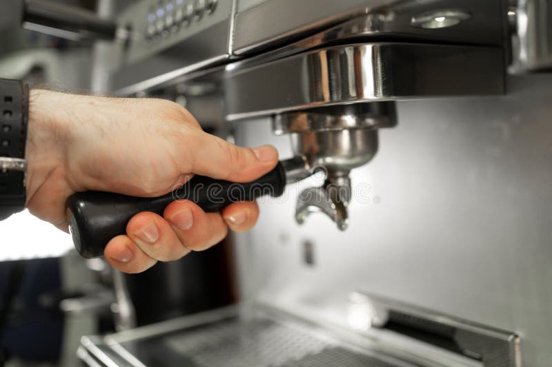 Close-up of Barista Inserting Portafilter into Coffee Machine Espresso ...