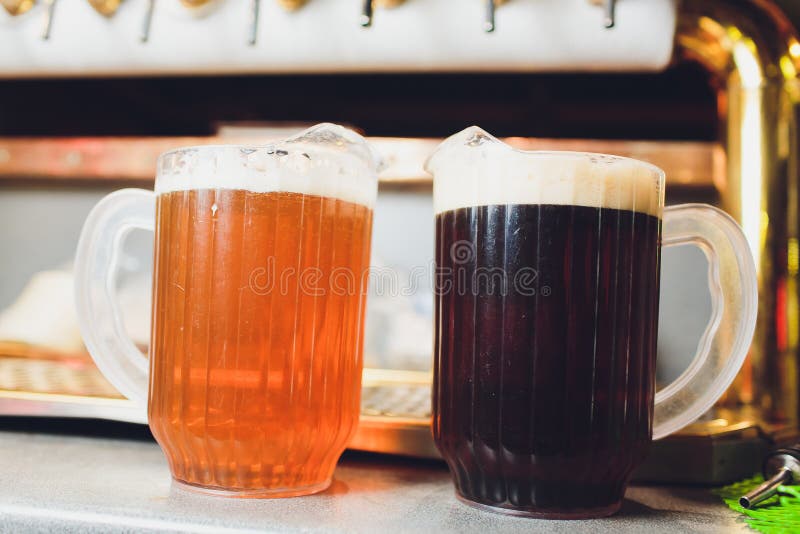 Close-up of Barman Hand at Beer Tap Pouring a Draught Lager Beer. Stock ...
