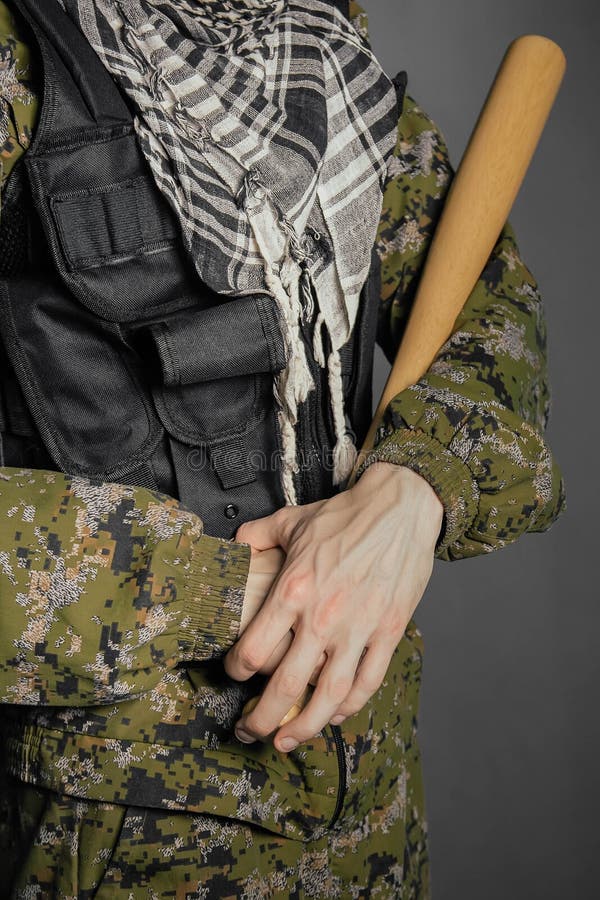 Close-up Baseball Bat in the Hands of an Unknown Person in Camouflage ...