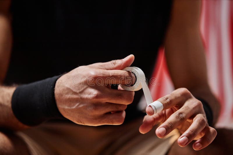 Close Up Basketball Player Using Finger Tape Stock Photo - Image of ...